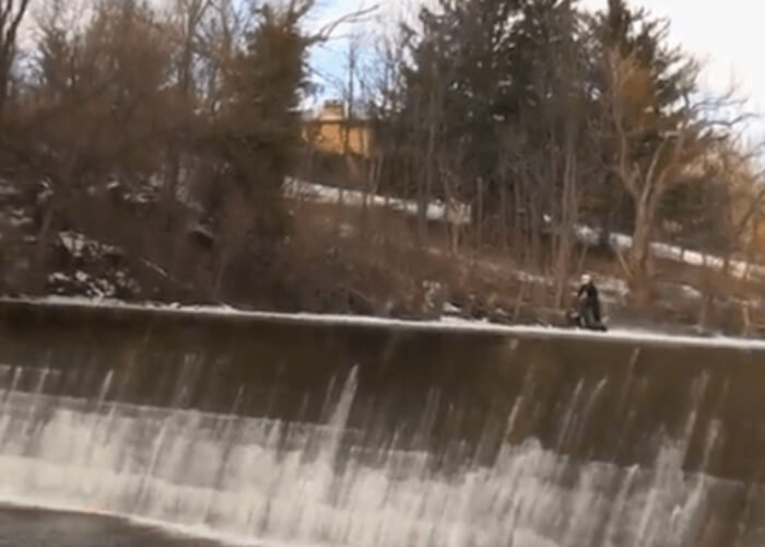 VIDEO: Awesome Snowmobile Dam Jump