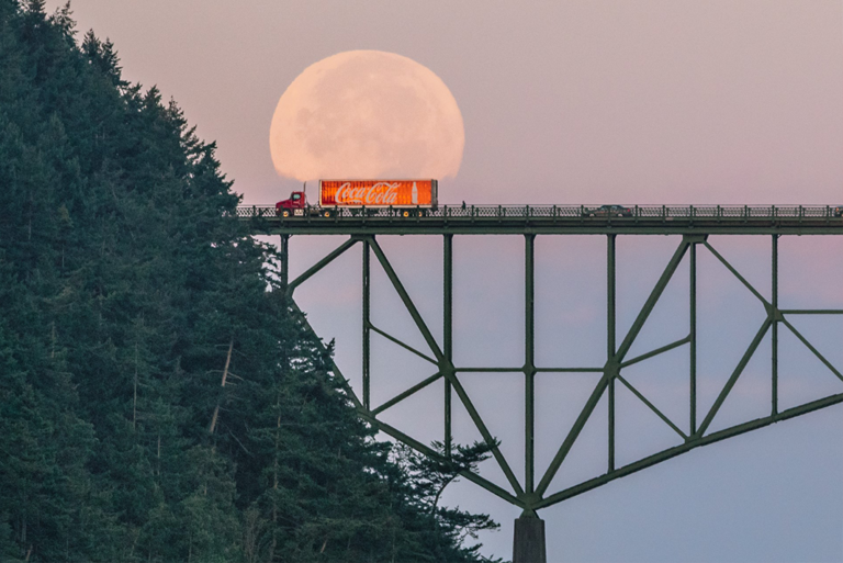 PHOTO: Coca Cola truck hauls the moon across a bridge