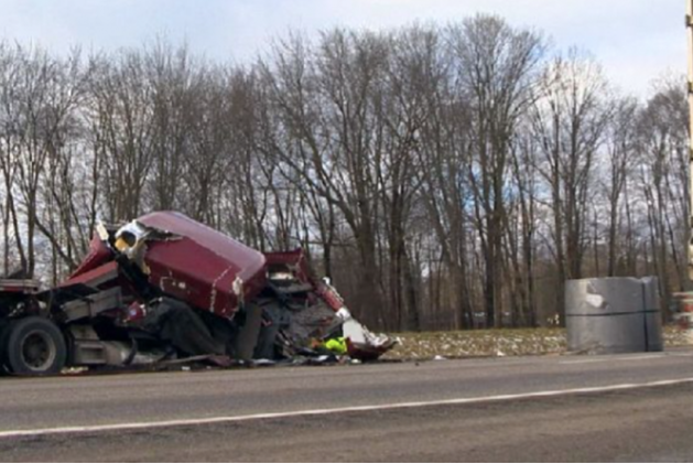 Trucker survives after loose steel coil rolls over, flattens cab