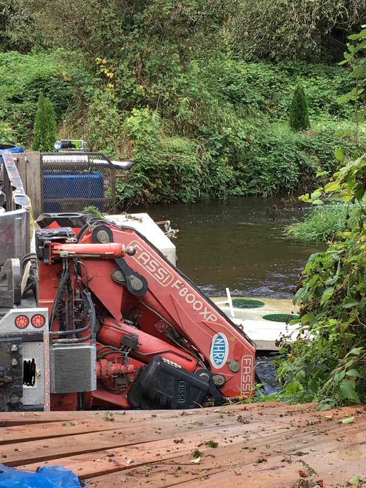 Bridge collapse sends truck plummeting into creek