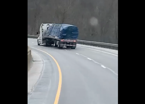 Load shift topples truck on West VA Turnpike
