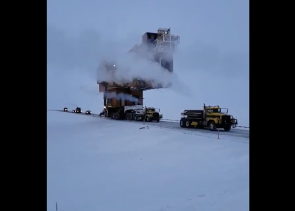 Truckers work together for massive drilling rig move