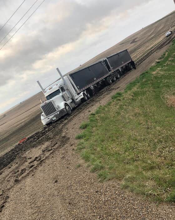 Using farm equipment to rescue a stuck semi goes spectacularly awry