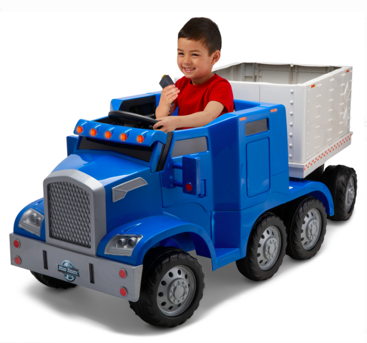 This rideable toy semi truck has a 'CB' and a detachable trailer and ...