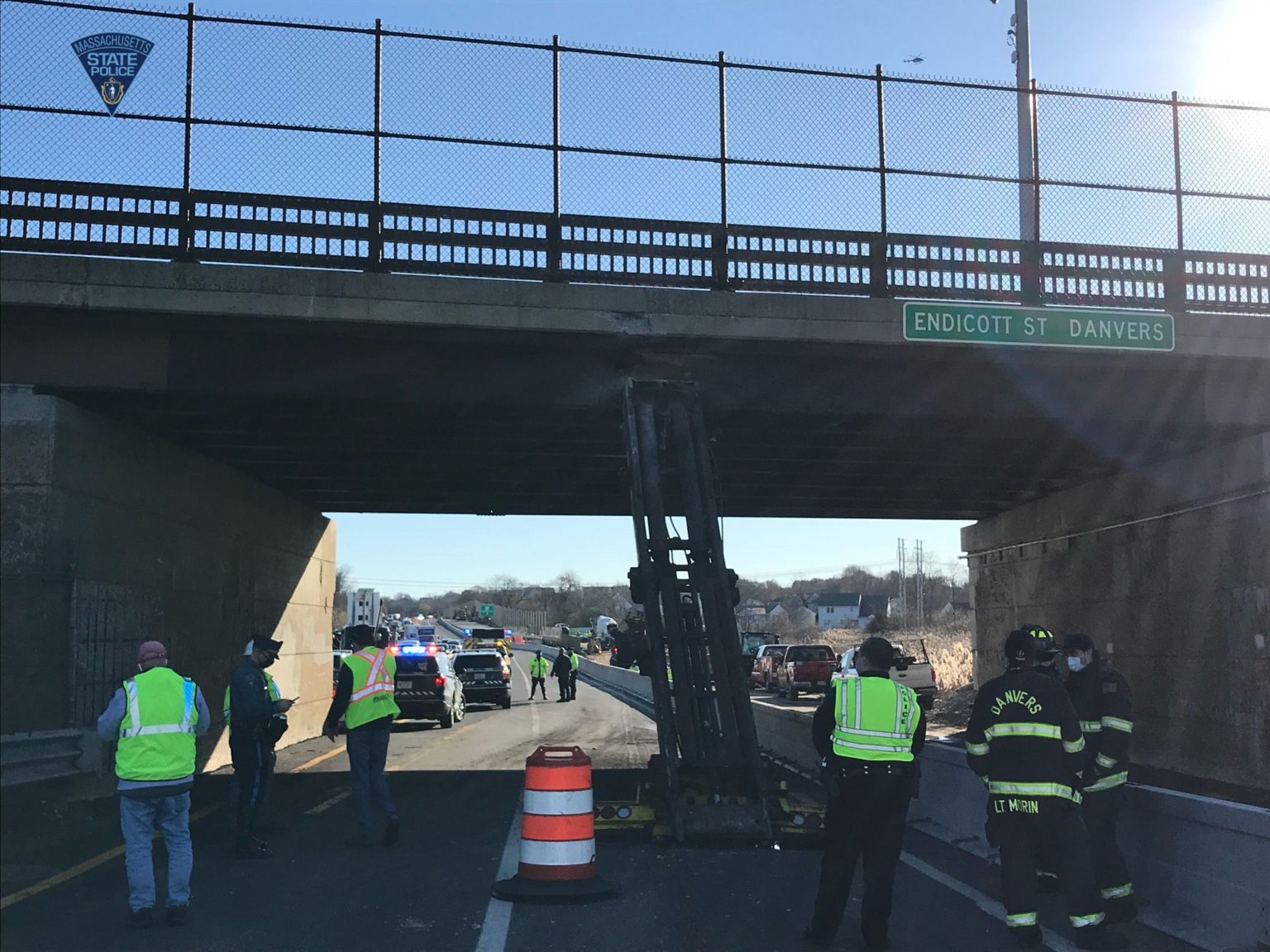 Truck driver hospitalized after bridge strike