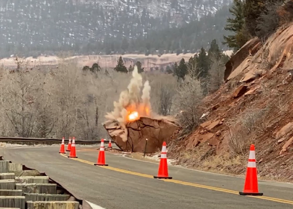 Crews blast 200-ton rock with dynamite on Colorado highway