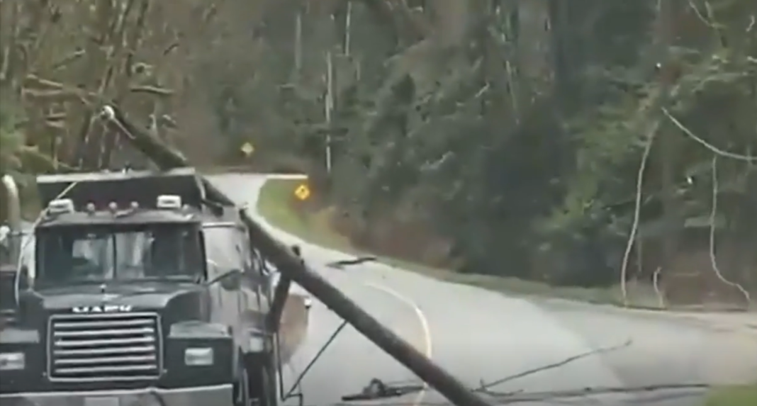 WATCH: Oblivious dump truck driver nearly drags utility pole into ...