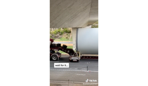 WATCH: Trucker maneuvers oversized load under bridge with only inches ...