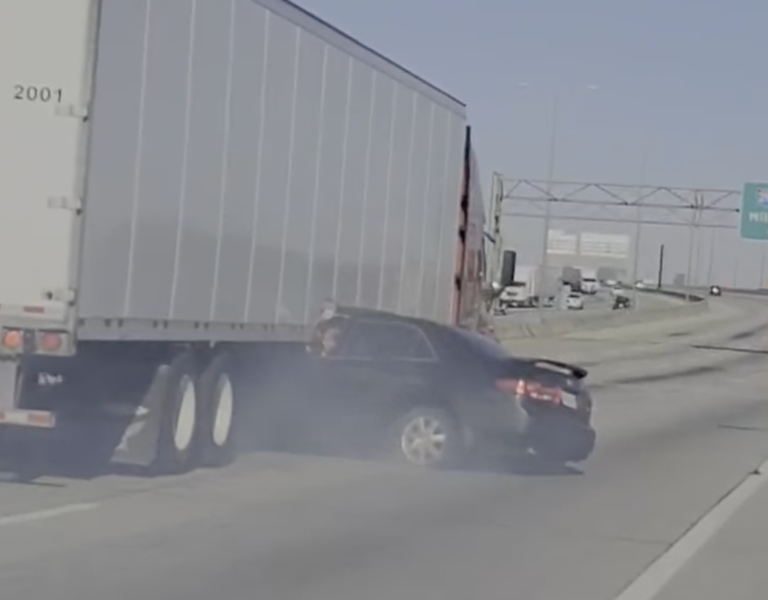 VIDEO: Semi truck drags car wedged under trailer down the interstate