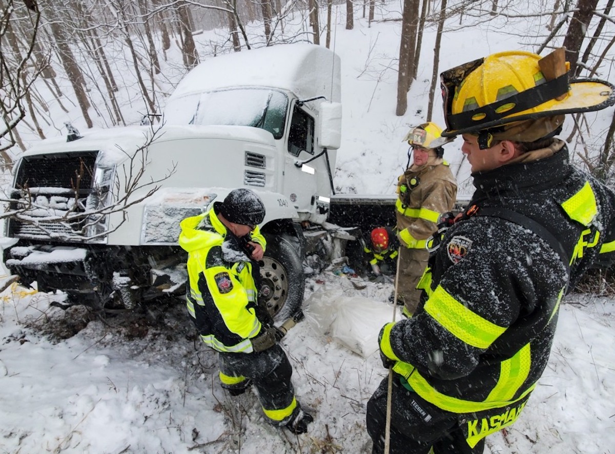 Trucker saved via rope rescue after sliding down embankment