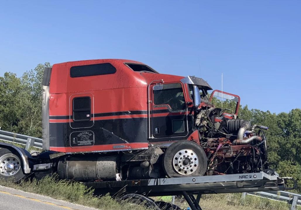 Big rig plows through guardrail only to land in dry creek bed below