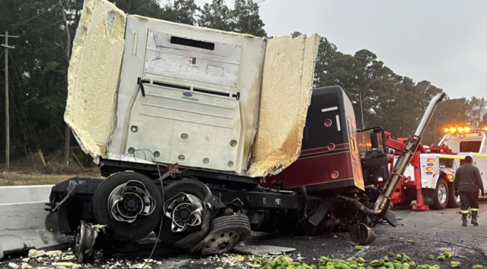 Tractor trailer rides guardrail after steer-tire blowout