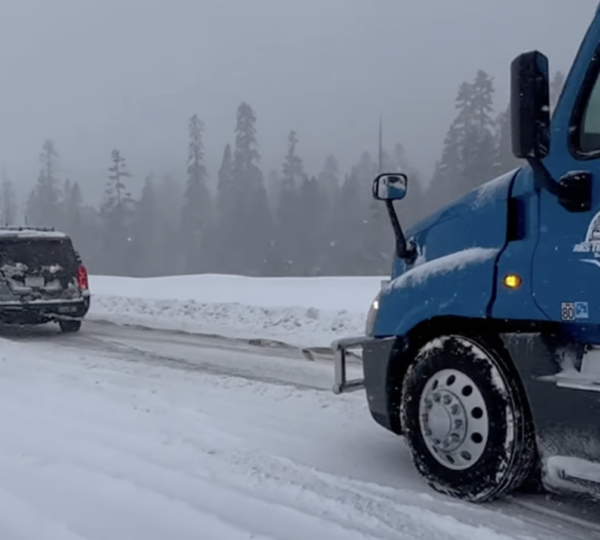VIDEO: CHP troopers team up to push/pull a stuck semi truck