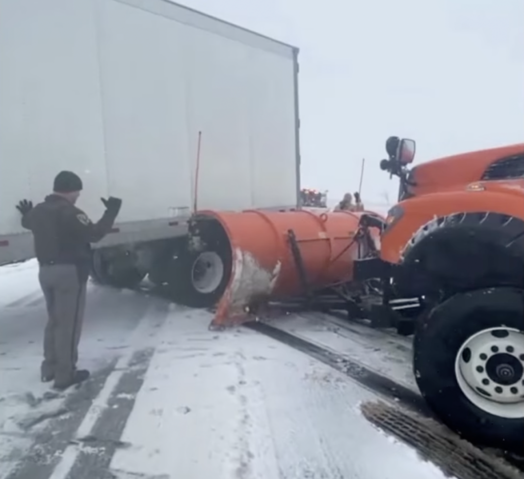 VIDEO: North Dakota troopers use snow plow to clear stuck big rig