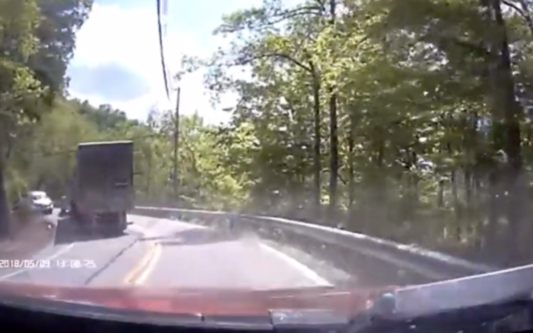 VIDEO: Trucker runs SUV off winding mountain road