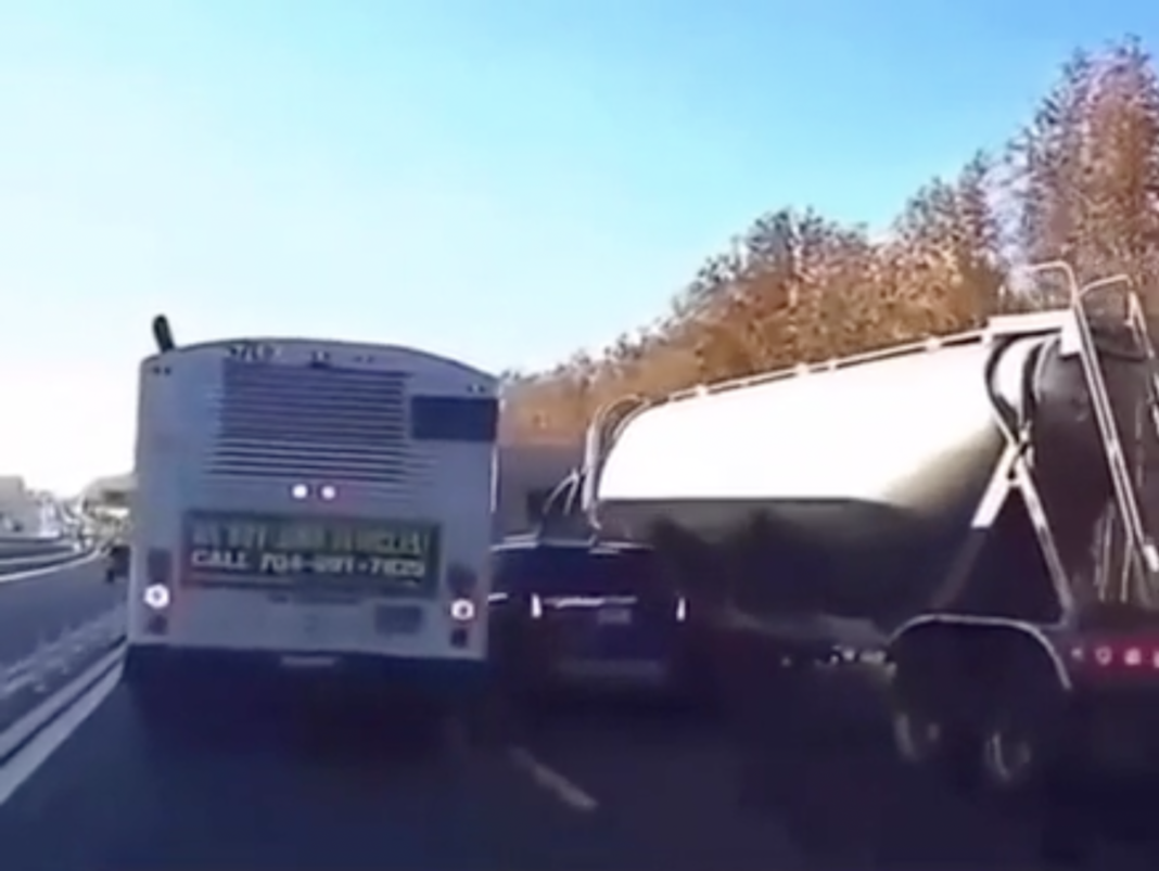 Dash cam captures a car getting sandwiched between a truck and a bus