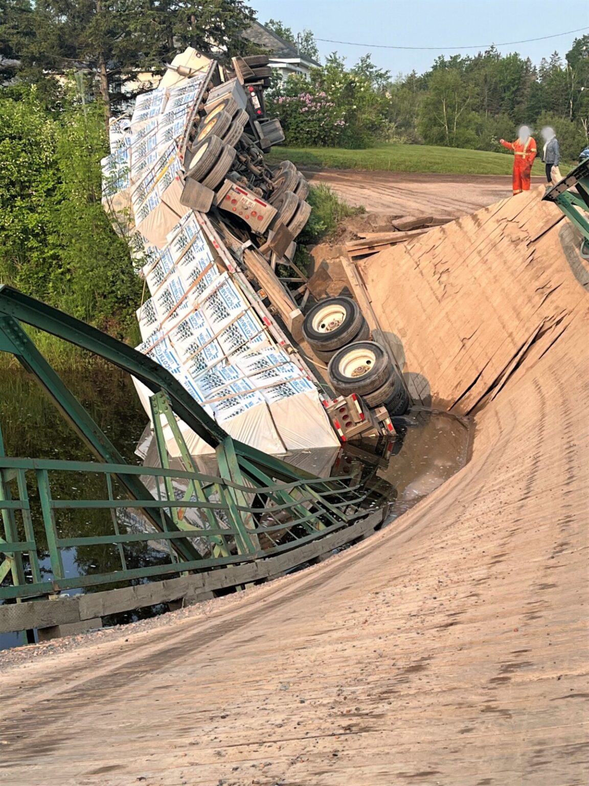 Rural bridge collapses after big rig drives over, police say