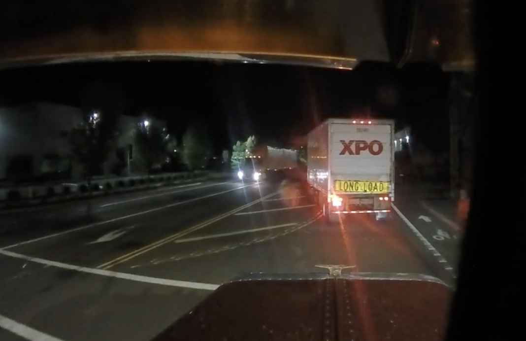 Inconsiderate wiggle wagon pulls in front of driver with the green light