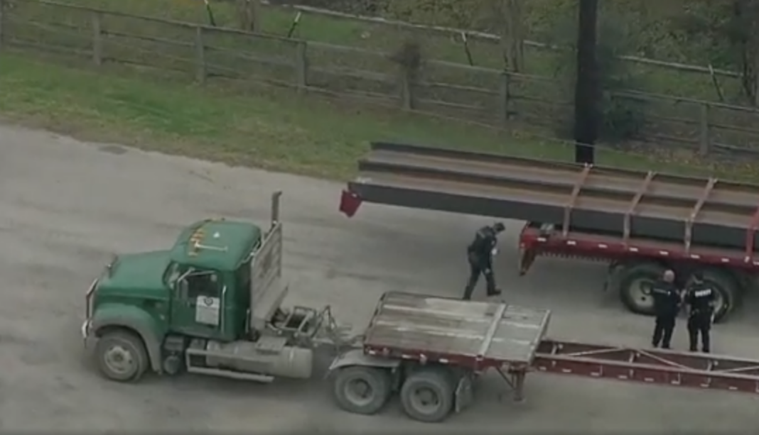 One dead after car drives under semi truck's load of steel beams