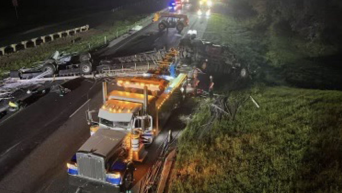 Six people inside cab of semi truck that flipped upside down