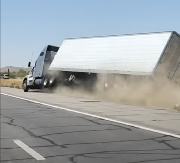 Dramatic video shows big rig veering off shoulder, rolling over