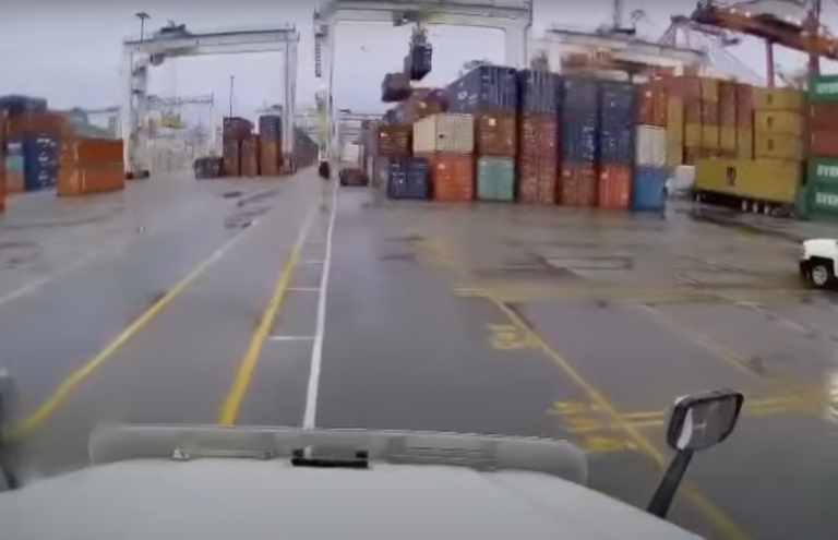 Video captures close call for trucker after crane knocks container off ...