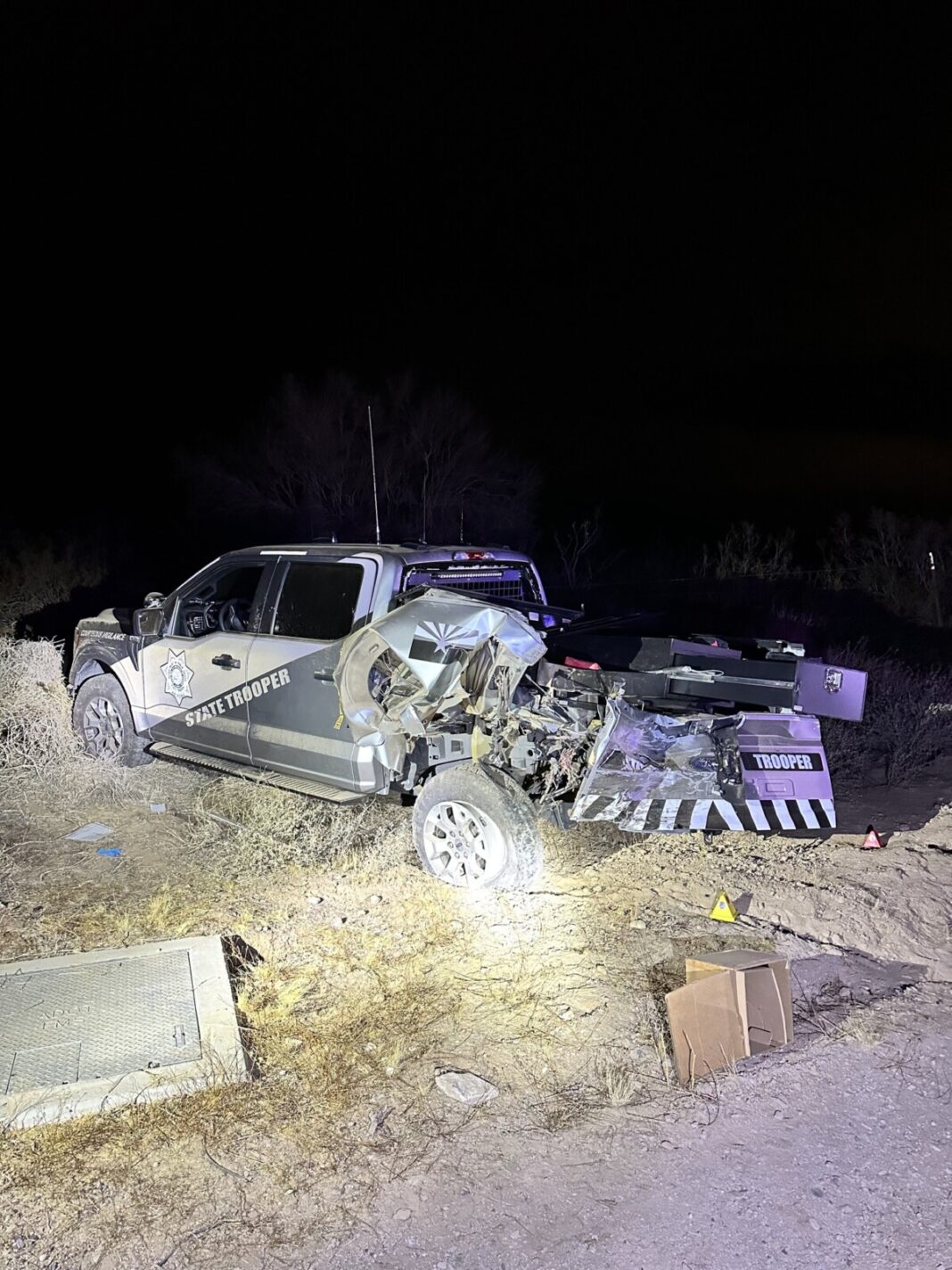 Pickup hauling three cars plows into Arizona trooper's cruiser parked ...