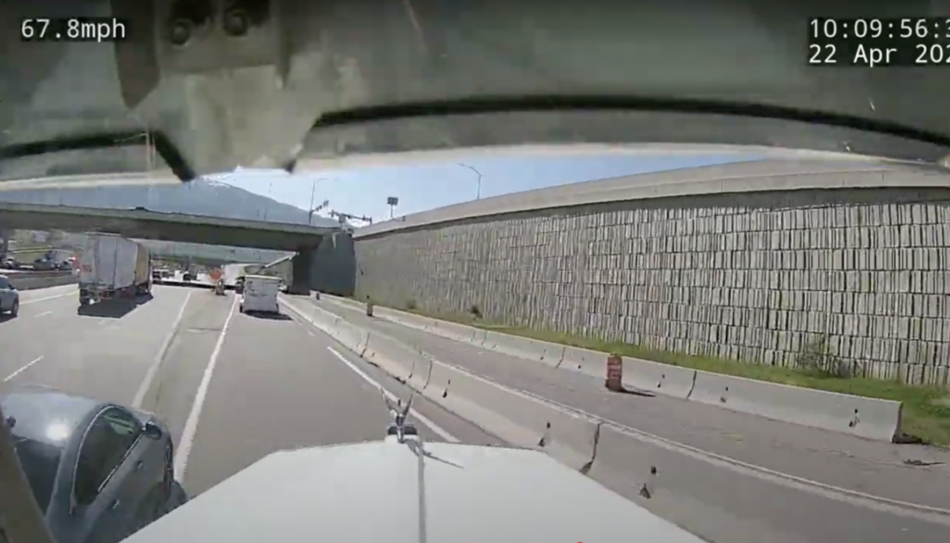 Dash cam shows car driver cutting off semi truck to reach exit, causing ...