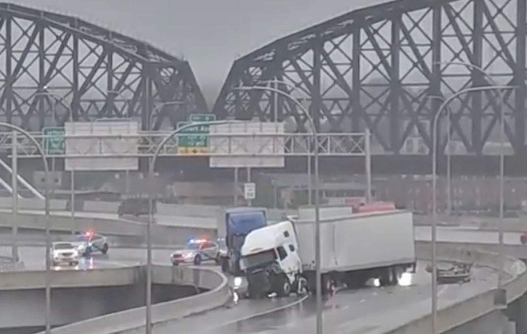 Driver rescued from dangling semi truck one of three truck crashes in that same spot over the ...