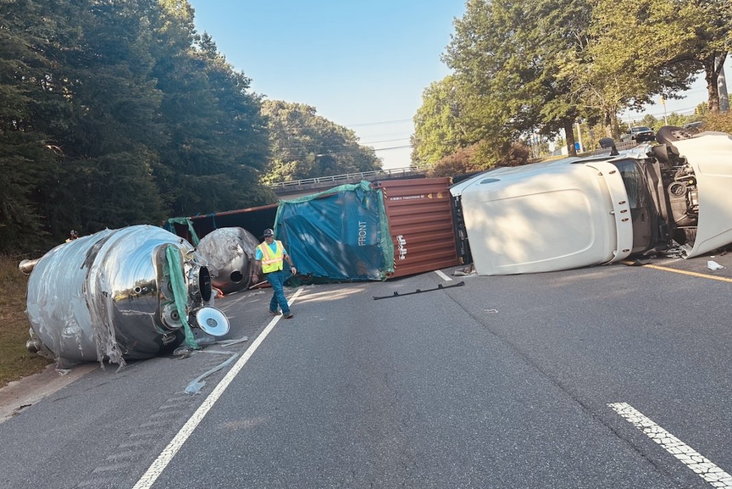 Large equipment spilled and bridge damaged in tractor trailer overturn