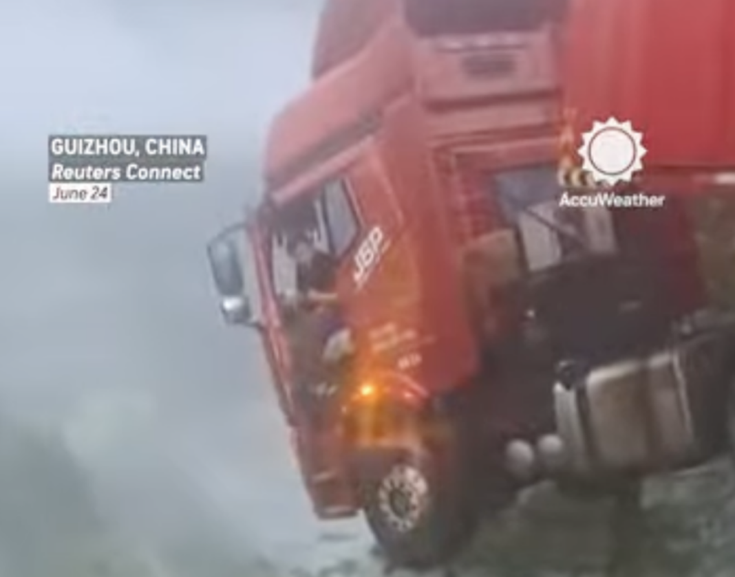 Watch as this Chinese trucker dramatically dangles off bridge ripped in ...