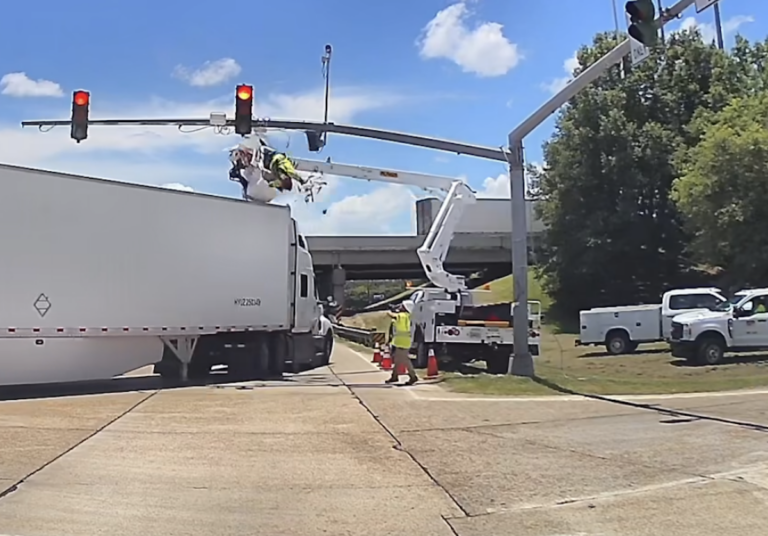 Video shows moment worker was knocked from a bucket truck by passing ...