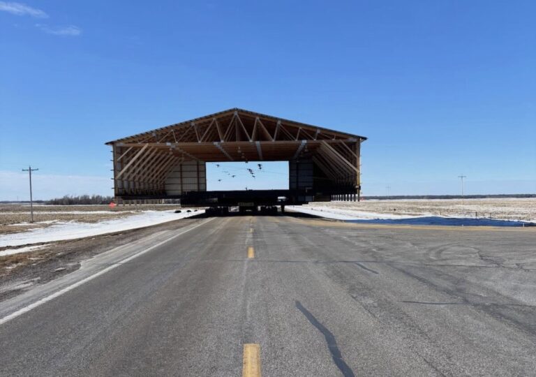 North Dakota troopers escort semi truck hauling 81 foot wide building ...