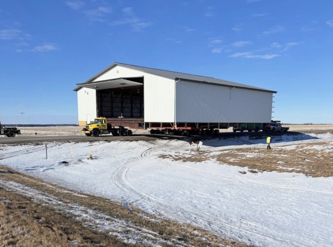 North Dakota troopers escort semi truck hauling 81 foot wide building ...