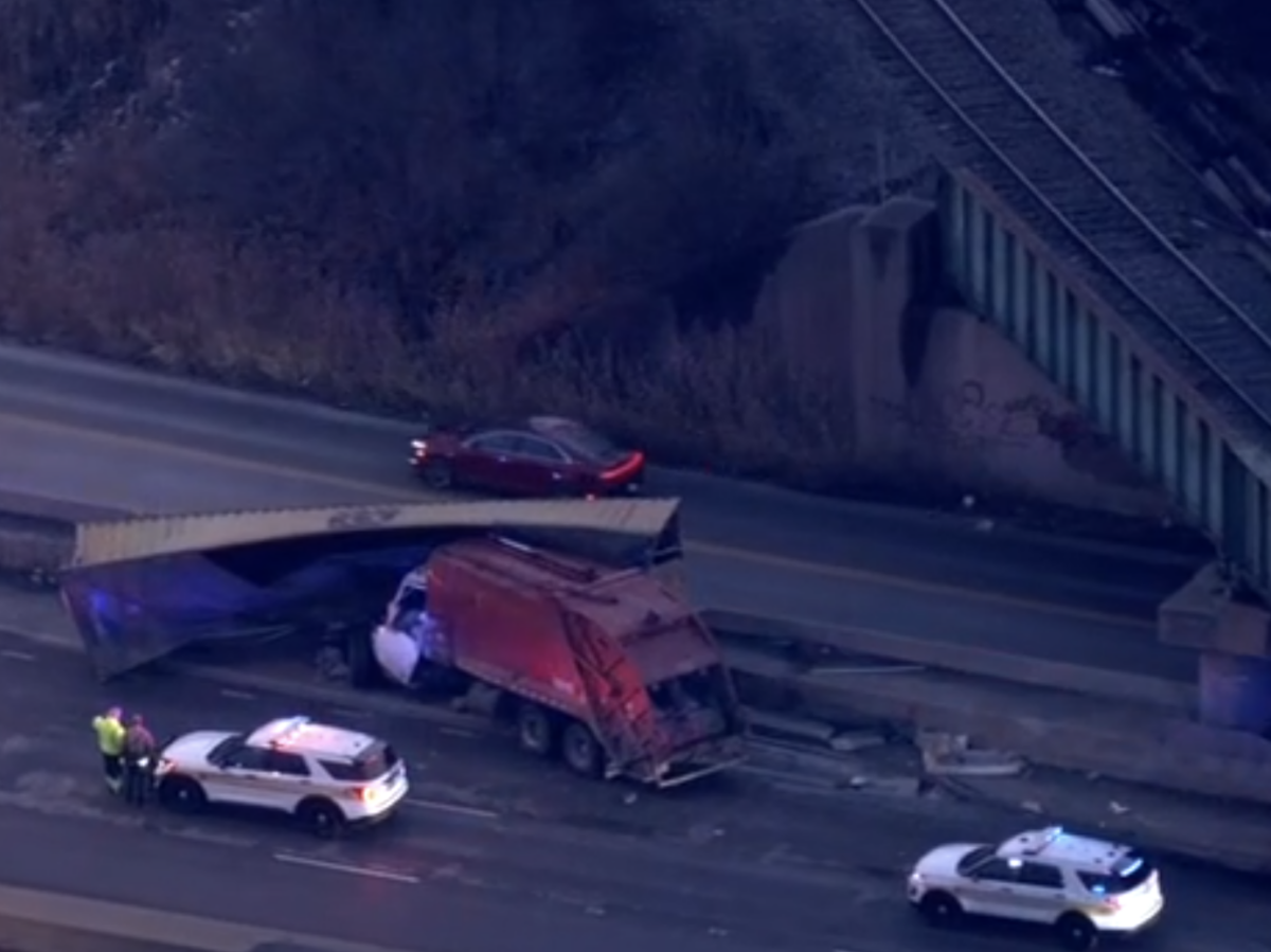 Bridge strike ends in crash with a garbage truck on South Side of Chicago