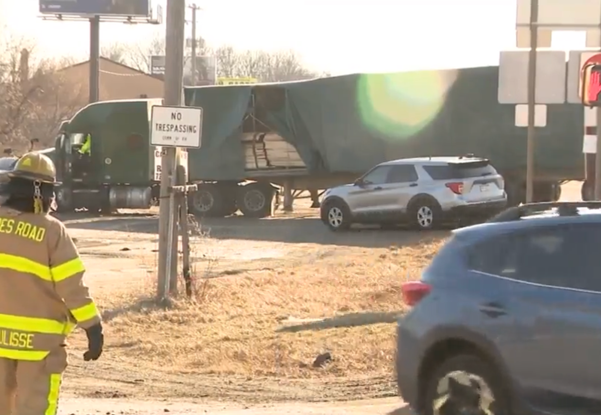 Truck driver arrested on homicide charges after blaming sun glare for ...